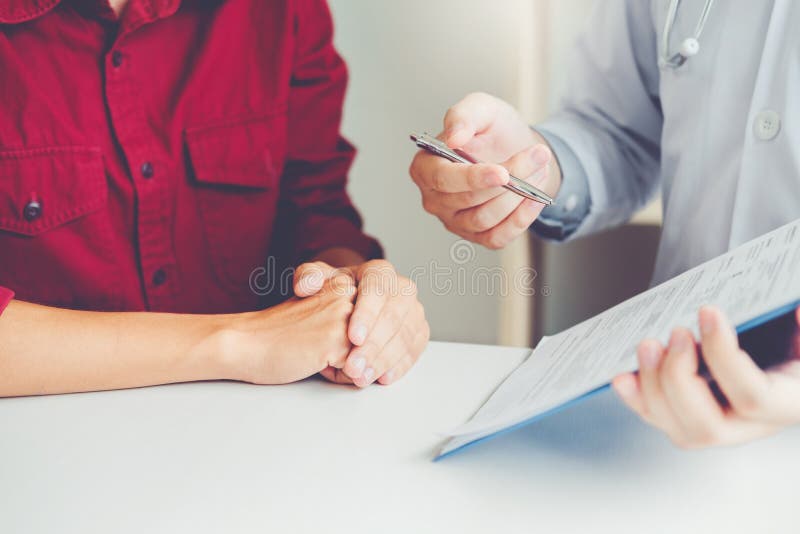 Doctors And Patients Sit And Talk. At The Table Near The Window Stock ...