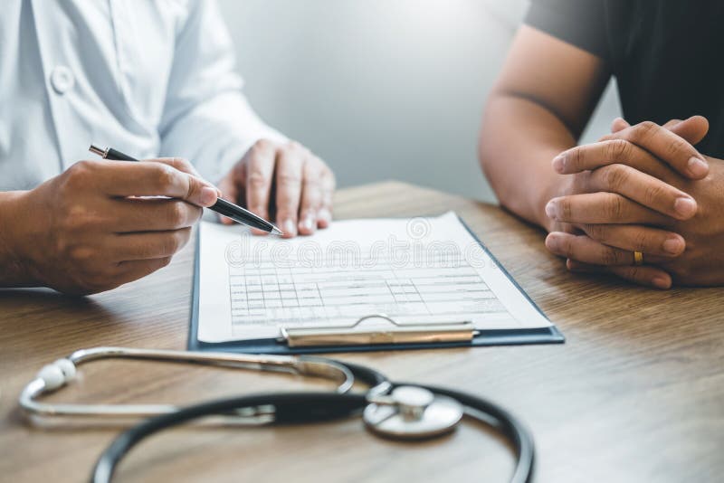 Doctors and Patients Sit and Talk. at the Table Near the Window in the ...