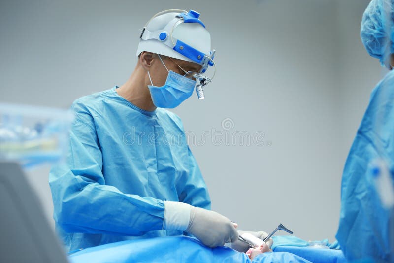 Doctors Performing Operation in Surgery Room Stock Photo - Image of ...