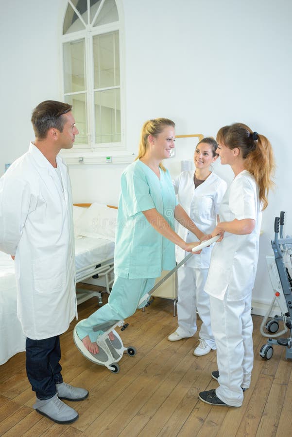 Doctors during Physical Therapy Session Stock Photo - Image of ...