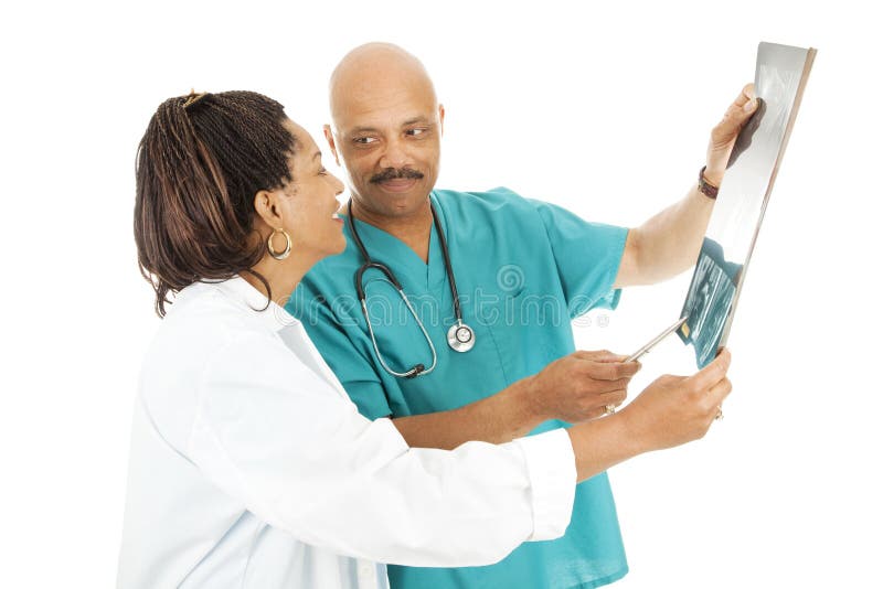 Doctors Review a Chart stock photo. Image of consultation - 1078710