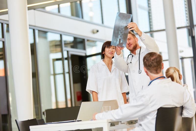 Doctors Look at X-ray Image in a Training Stock Photo - Image of ...