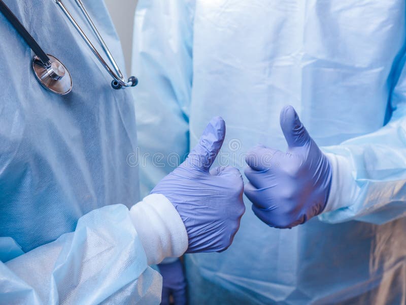 Doctors showing thumbs up stock image. Image of hand - 176934529