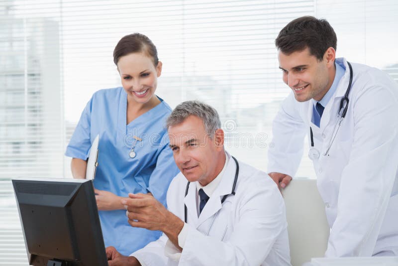 Doctors Looking at Computer on Meeting Stock Image - Image of clinic ...