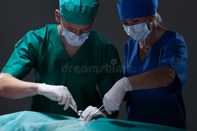 Doctors during surgery stock photo. Image of medical - 42407570