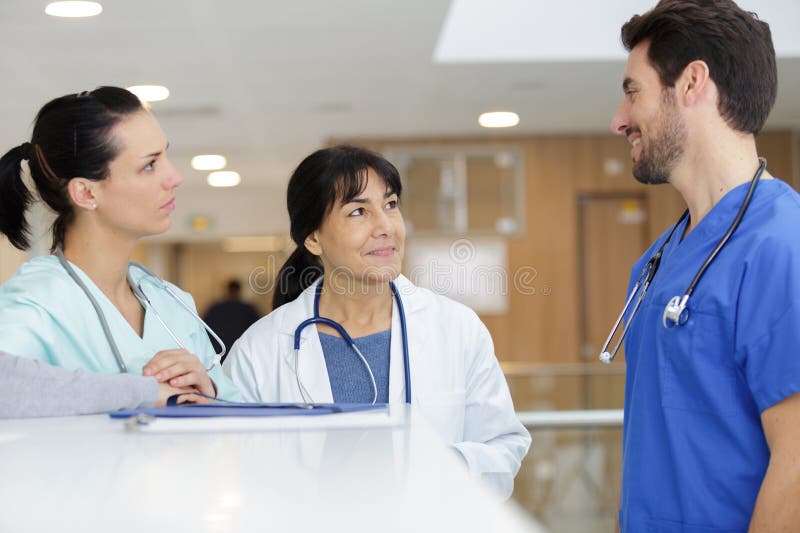 Two Doctors Talking To Each Other in Hospital Stock Photo - Image of ...