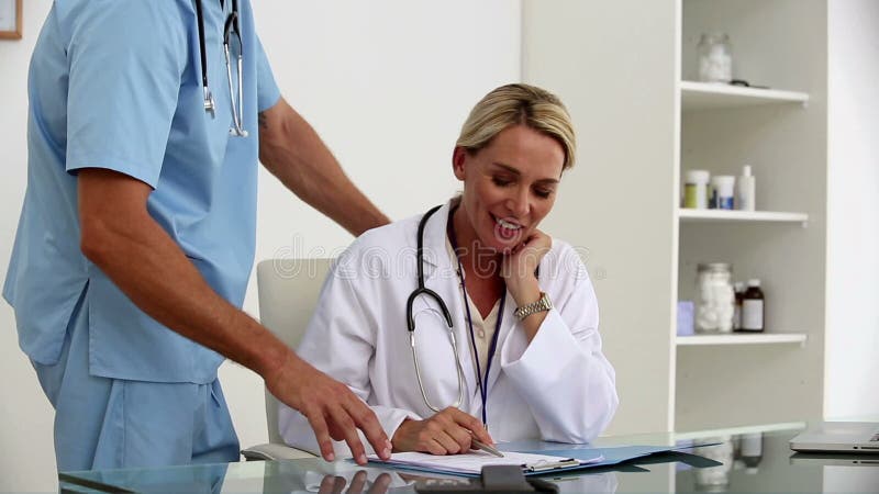 Doctors Talking Together while Talking about a Patient Stock Video ...