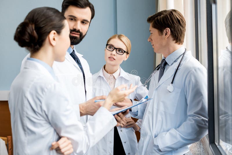 Doctors Team Discussing Diagnosis Stock Photo - Image of conversation ...