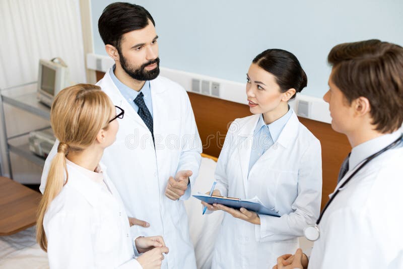 Doctors Team Discussing Diagnosis Stock Photo - Image of conversation ...