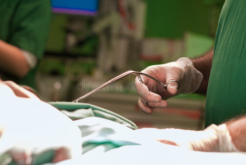 Doctors With Tools In Hands Making Surgery Stock Image - Image of ...