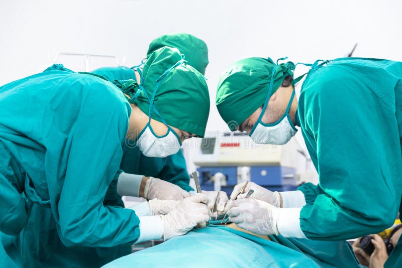 Doctors are Treating Patients in Operating Rooms. the Surgeon Team is ...