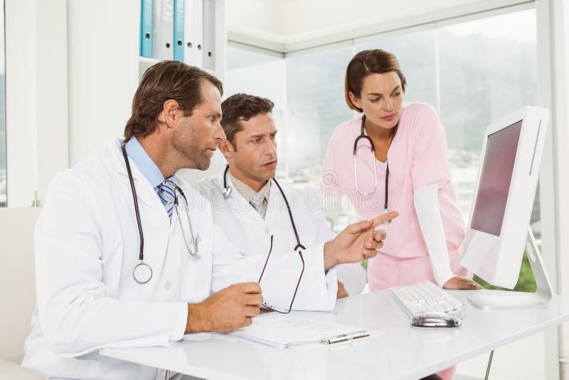 Doctors Using Computer at Medical Office Stock Image - Image of woman ...