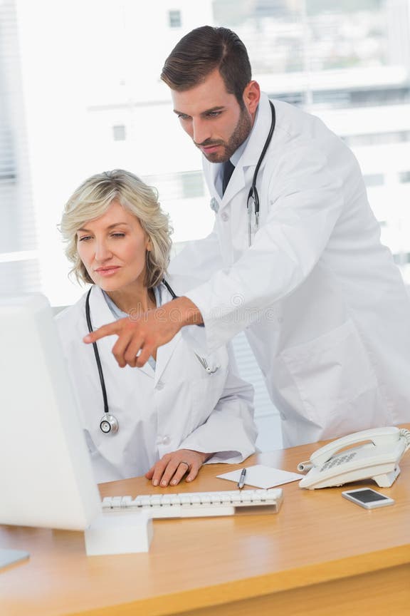 Doctors Using Computer at Medical Office Stock Image - Image of office ...