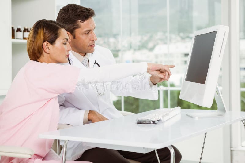 Doctors Using Computer at Medical Office Stock Photo - Image of ...