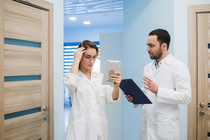 Doctors Using a Digital Tablet in an Hospital Stock Image - Image of ...