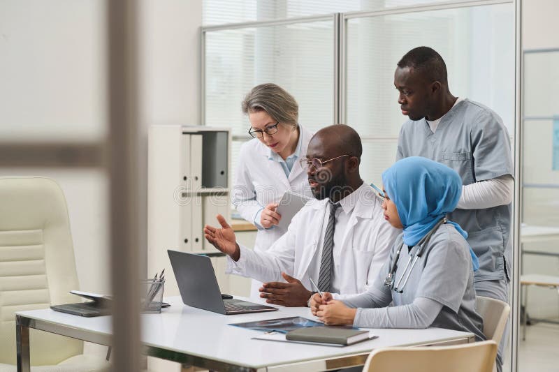 Doctors Using Laptop in Their Teamwork Stock Image - Image of group ...