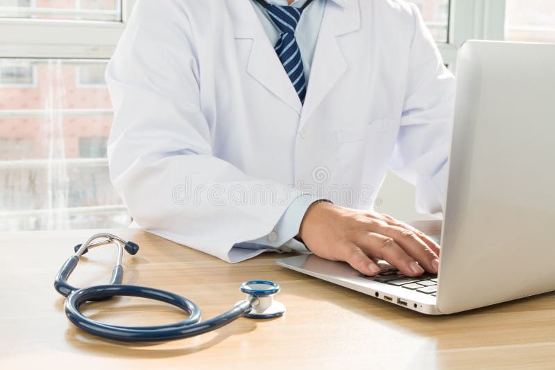 Doctors using laptop stock image. Image of notebook, internet - 63248287