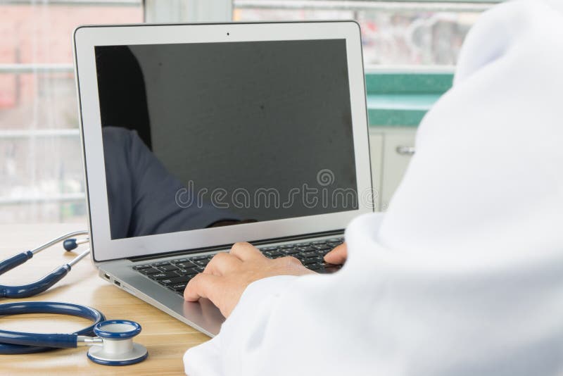 Doctors using laptop stock photo. Image of healthcare - 63249484