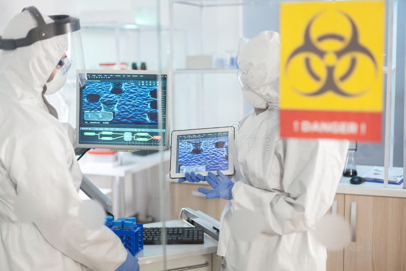 Doctors Wearing Ppe Suit Working in Lab Danger Zone Area Stock Photo ...