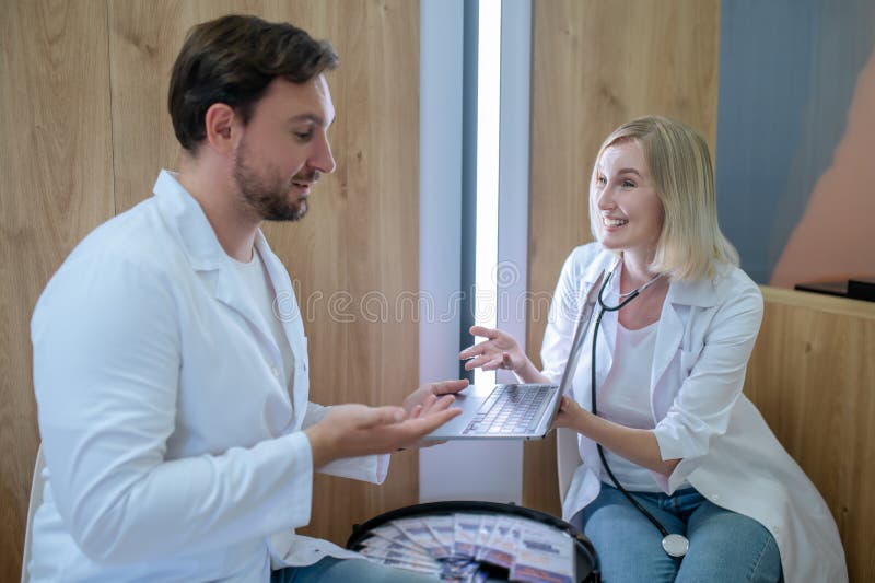 Two Young Doctors at Worki at the Hospital Stock Photo - Image of ...