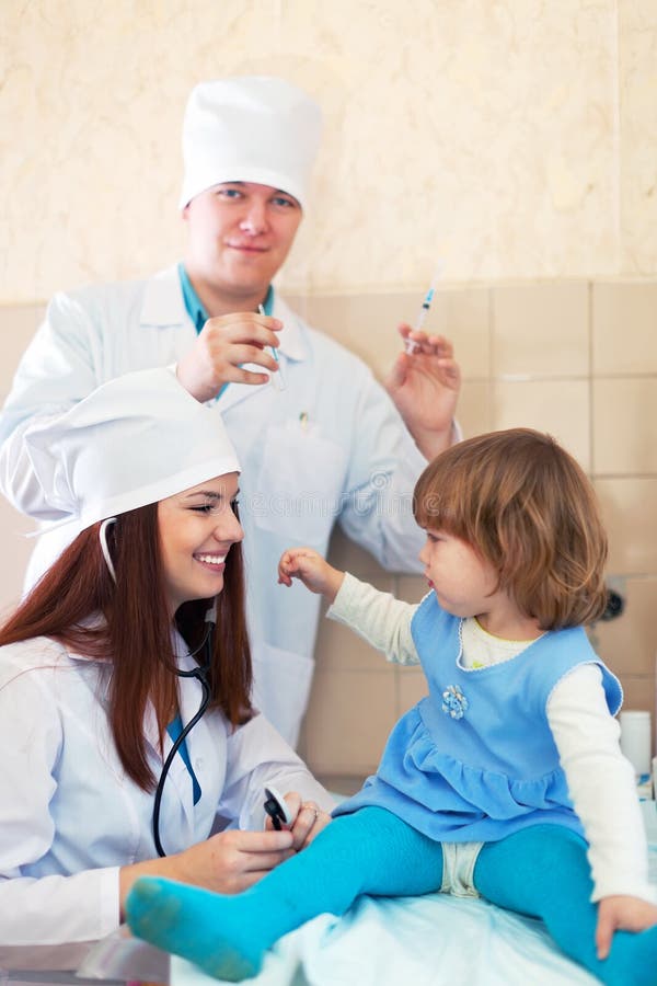 Doctors working with baby stock image. Image of cure - 27433513