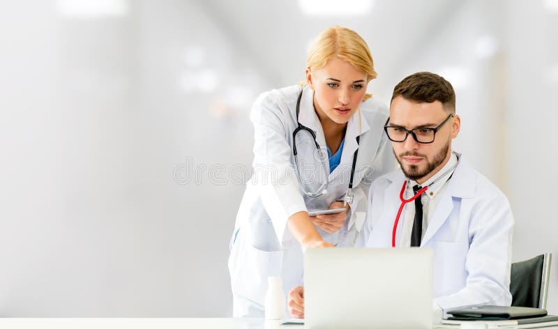 Doctors Working with Laptop Computer in Hospital. Stock Image - Image ...