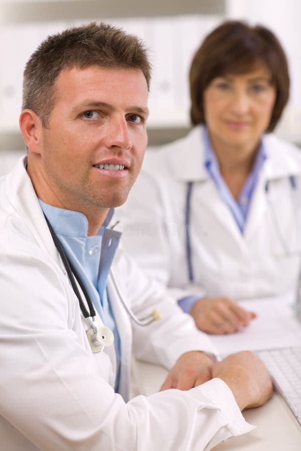Doctors working at office stock image. Image of diagnose - 7975901
