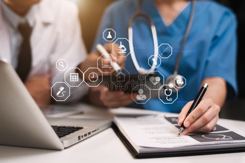 Doctors Working Together on Digital Tablet Healthcare Doctor Technology ...