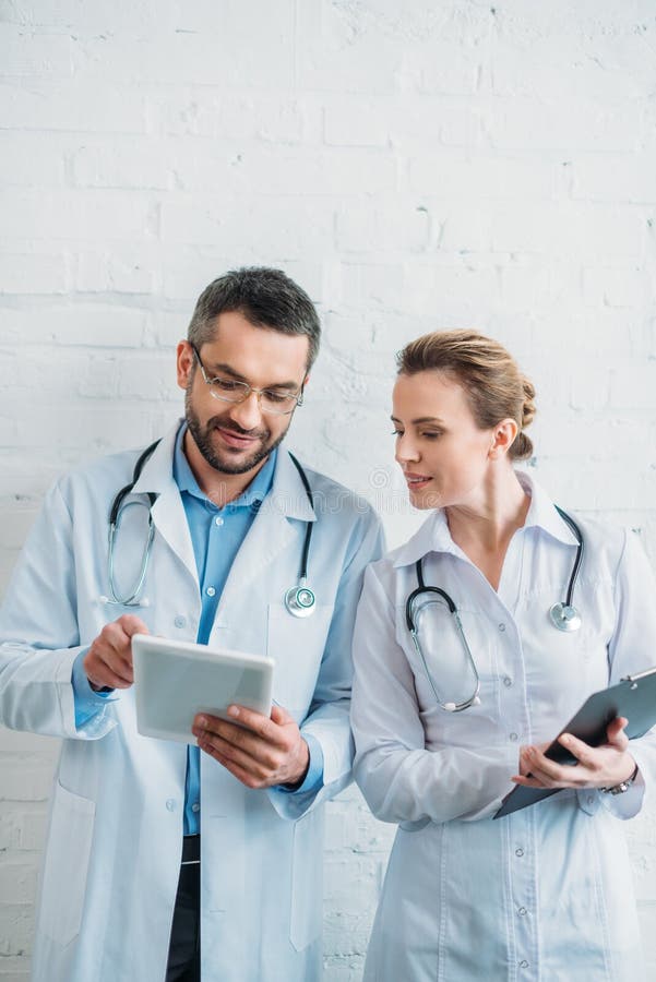 Doctors Working Together with Tablet Stock Image - Image of ...