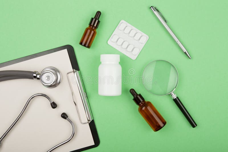 Doctors Workplace - Medical Tablet, Stethoscope, Pills and Magnifying ...