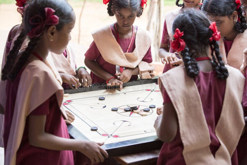 Documentary Editorial Image. Children Playing Carrom at the Table. the ... Documentary Editorial Image. Children Playing Carrom at the Table. the ...