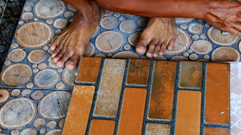 Construction Workers when Installing Ceramic Tiles for Floors Stock ...