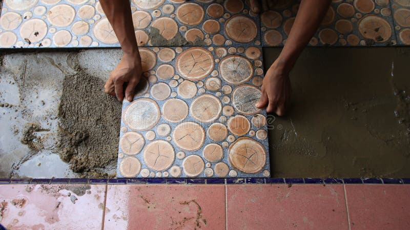 Construction Workers when Installing Ceramic Tiles for Floors Stock ...