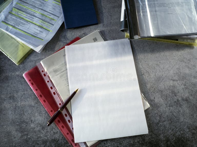 Documentation in Folders on the Table. Pen on a Clean Sheet of Paper ...
