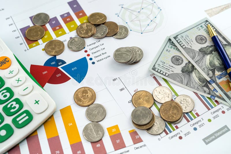 Documents with Graphs and Diagrams and Pen Calculator Us Dollar on Deks ...
