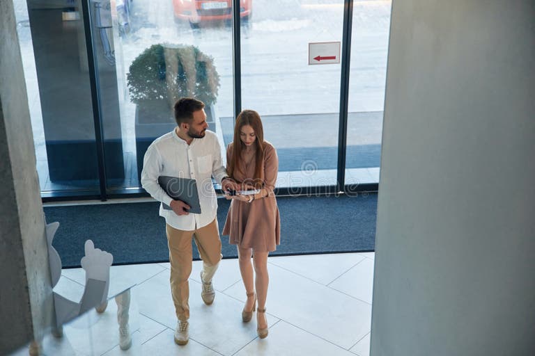 With Documents in Hands. Man and Woman are on the Way To Work To Office ...