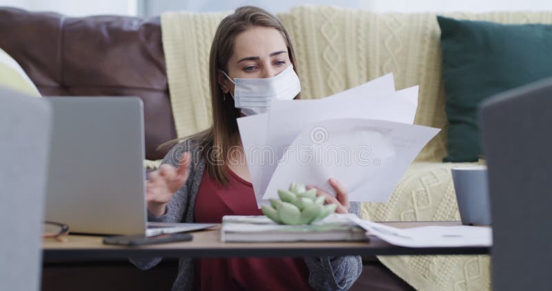 Documents, Laptop and Woman with Face Mask in Living Room Working on ...