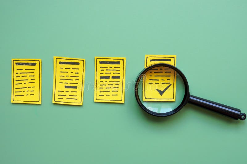 Documents and Magnifying Glass Representing Quality Control ...