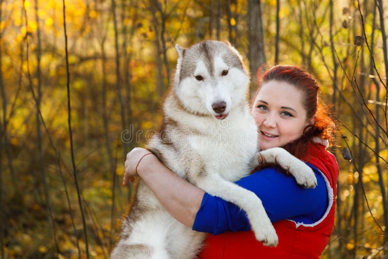 The Dog Breeder is Hugging with Her Husky Dog Stock Photo - Image of ...