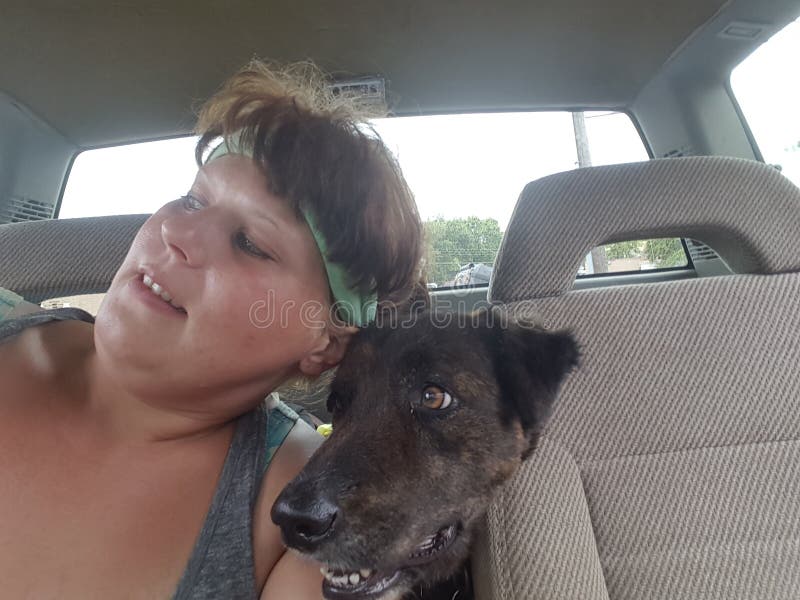 Dog and girl looking over stock image. Image of sideways - 77159831