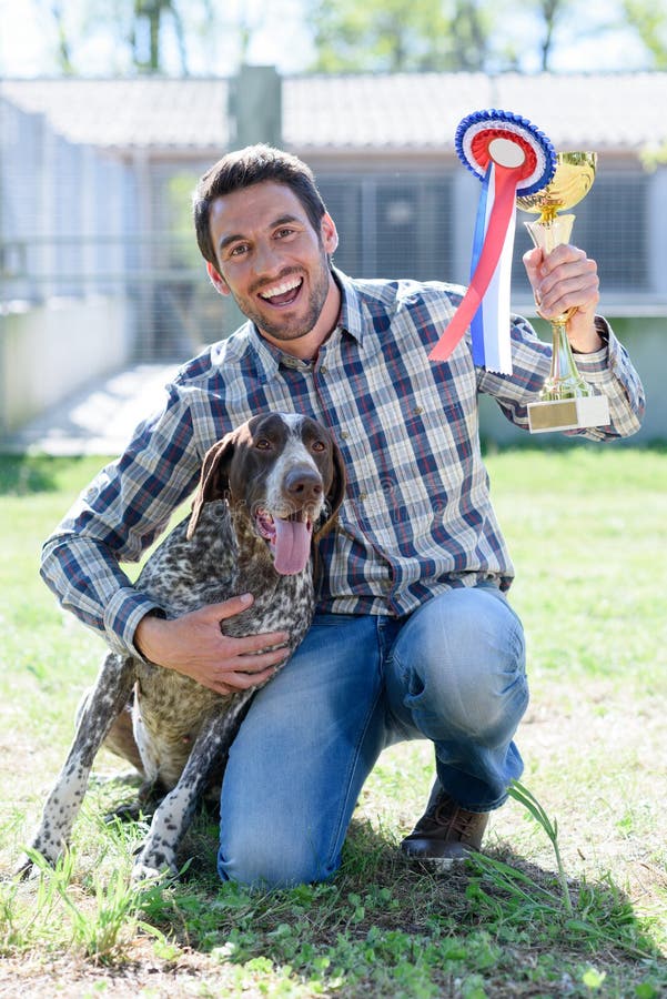 Dog owner and winner dog stock image. Image of friend - 186139809