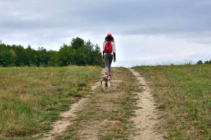 A Dog Runs Around the Legs of Hikers in Nature on a Hike Stock Image ... A Dog Runs Around the Legs of Hikers in Nature on a Hike Stock Image ...