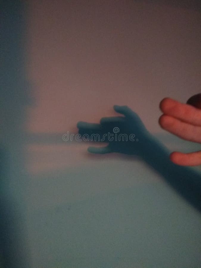 The Dog is the Shadow of a Hand Stock Image - Image of wall, blue ...