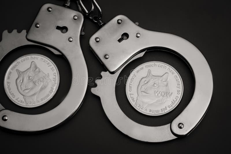Dogecoins and handcuffs editorial stock image. Image of concepts ...