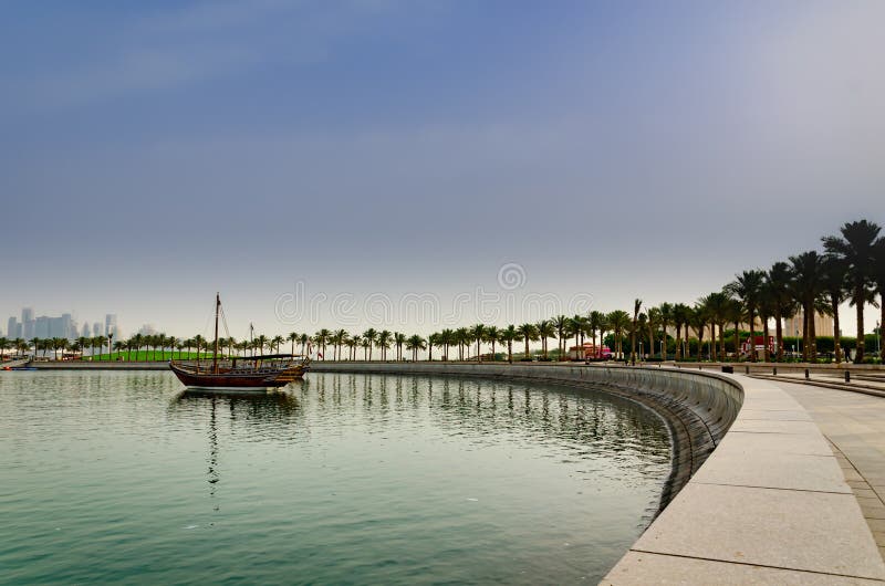Doha corniche stock image. Image of corniche, boat, monument - 272180925