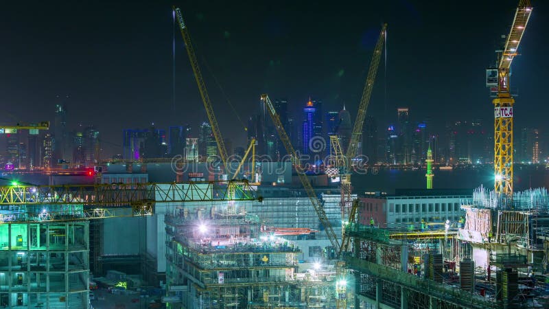DOHA, QATAR - OCTOBER 25, 2024: Nighttime Construction Site with Cranes ...