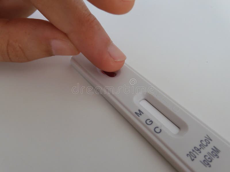 Doing a Coronavirus Covid-19 IgG / IgM Kit Test Finger with Blood Stock ...
