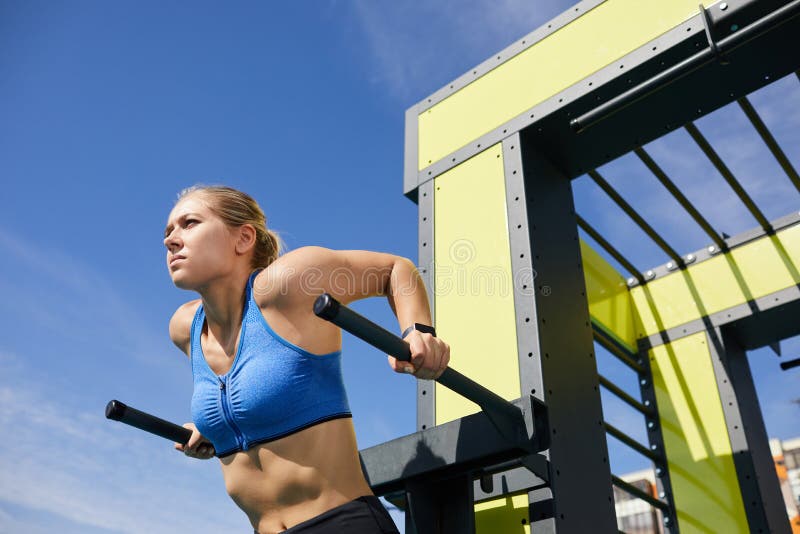 Doing Dips on Parallel Bars Stock Photo - Image of women, action: 249328092