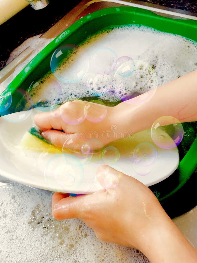 Doing the dirty dishes stock image. Image of bubbles - 70464497