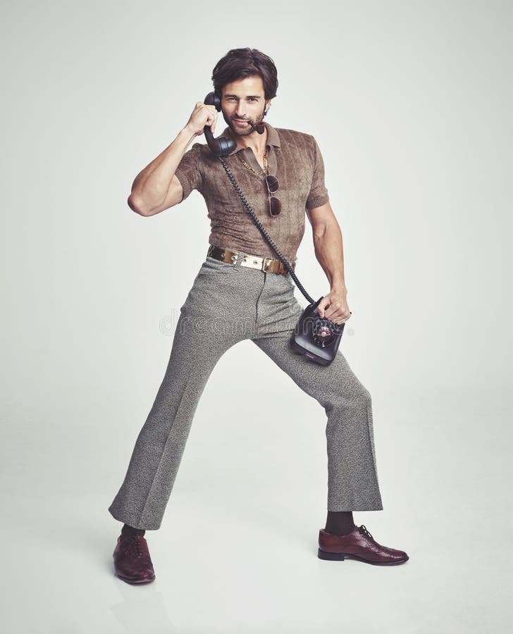 Doing Everything with Flair. a Handsome Man on a Retro Telephone while ...